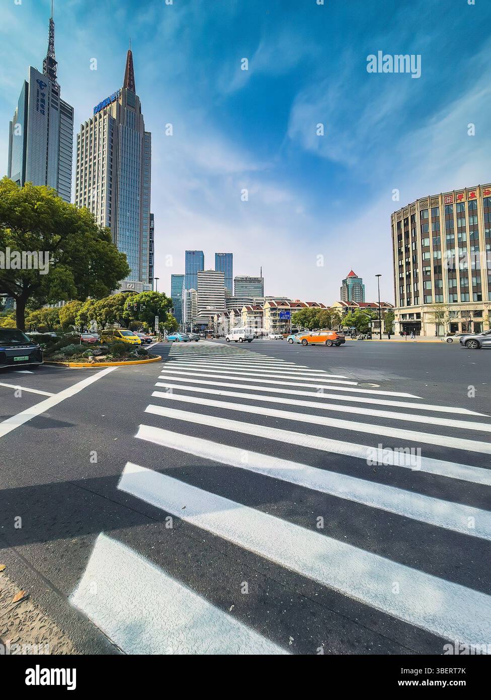 Shanghai, China - 1 April 2025: Wide pedestrian crossing at a large ...
