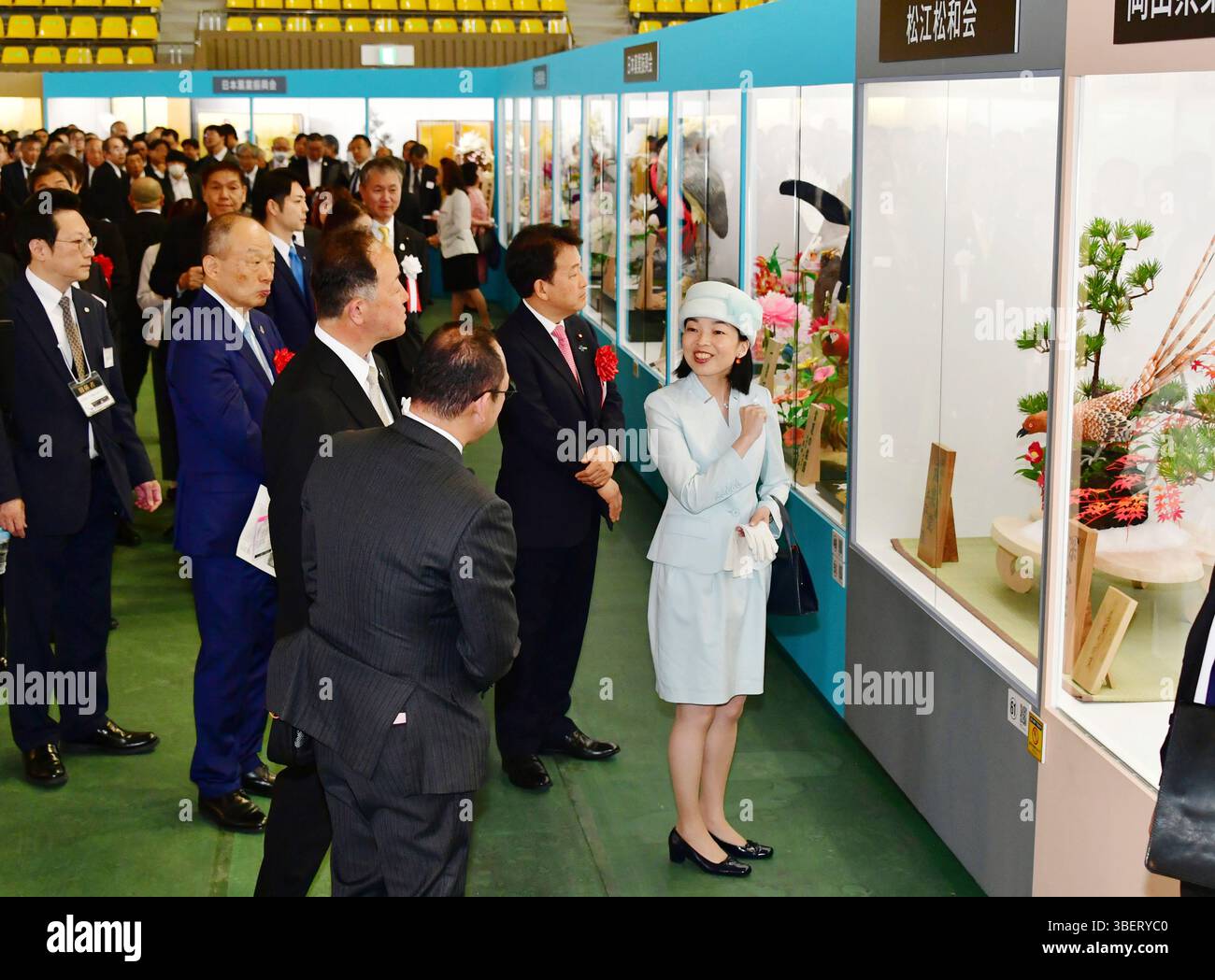 Princess Akiko of Mikasa looks at the display of crafted ...
