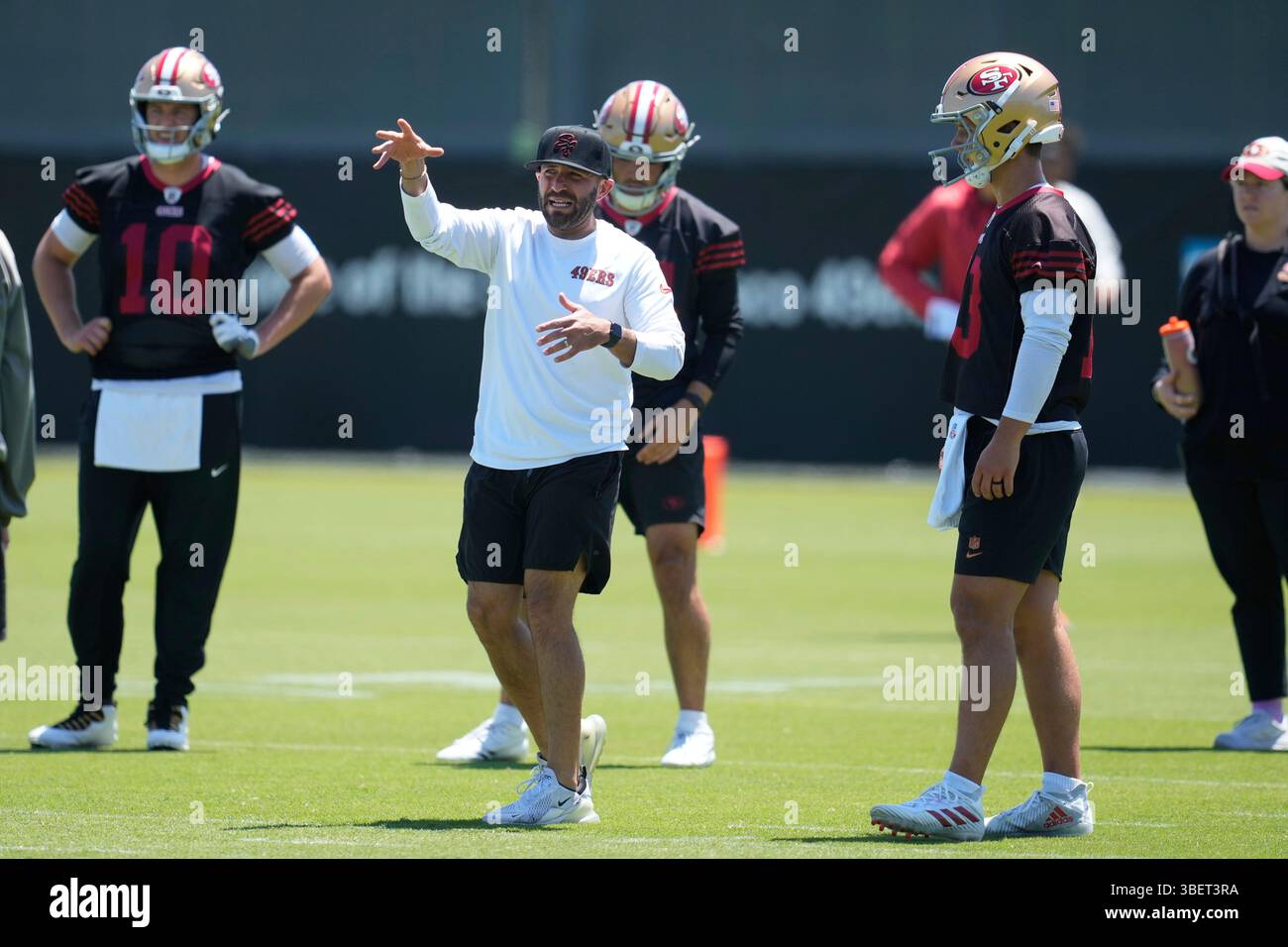 San Francisco 49ers quarterbacks coach Mick Lombardi gestures during ...