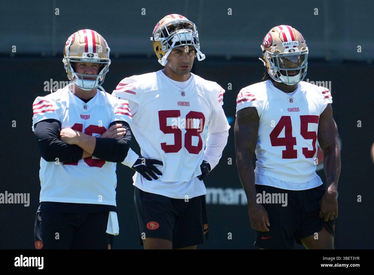 San Francisco 49ers long snapper Jon Weeks, left, linebacker Chazz ...