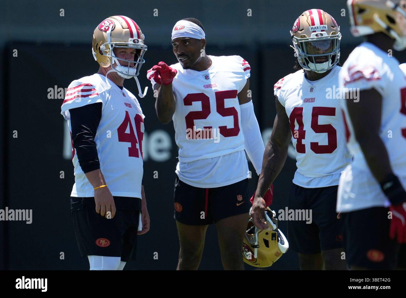 San Francisco 49ers long snapper Jon Weeks, left, safety Jason Pinnock ...