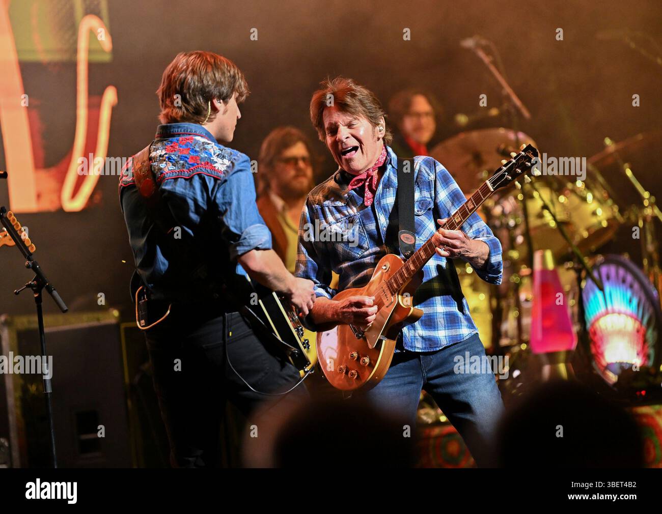 Musician John Fogerty, right, performs with his son Shane Fogerty ...