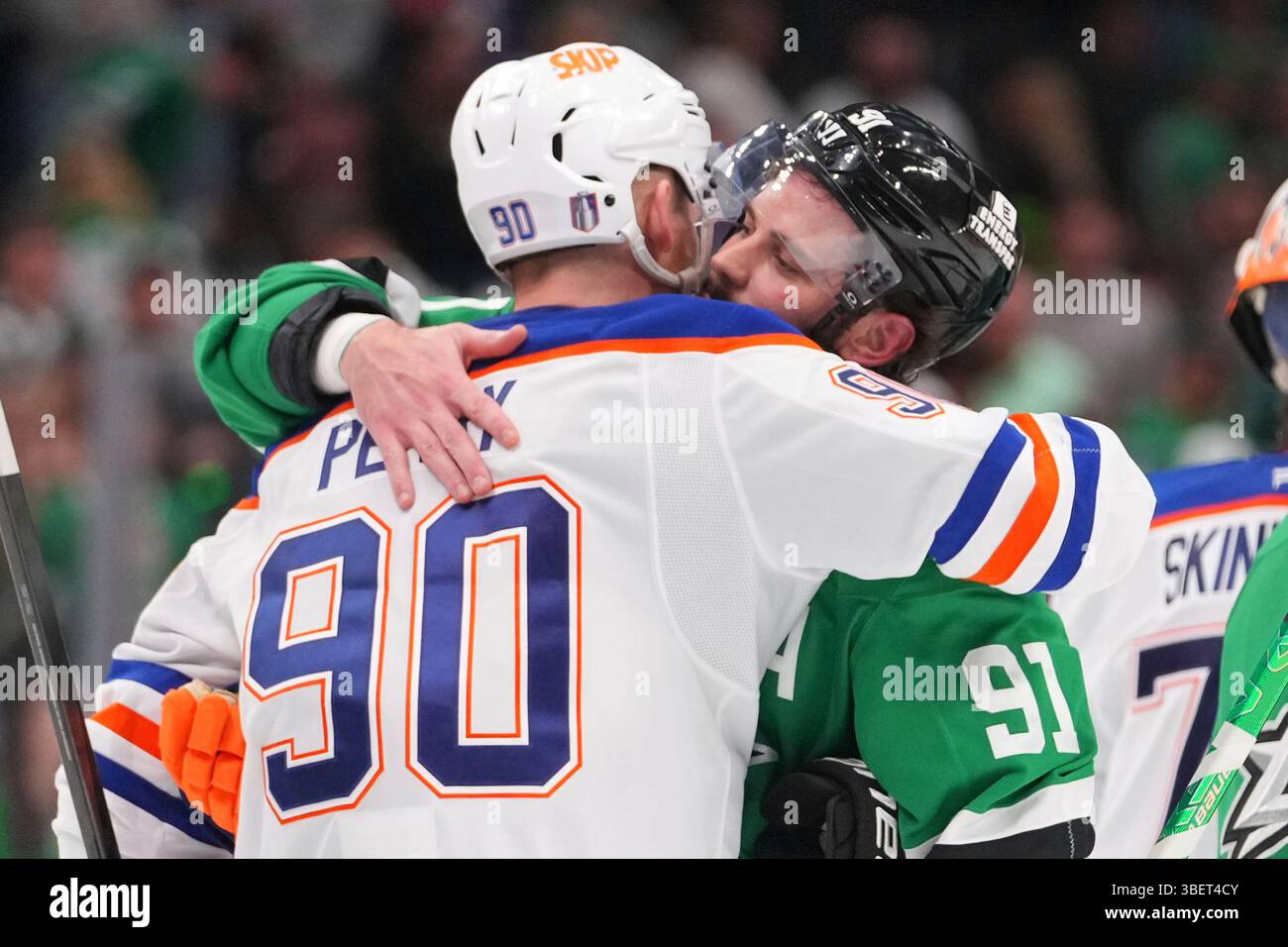 Edmonton Oilers right wing Corey Perry (90) greets Dallas Stars center ...
