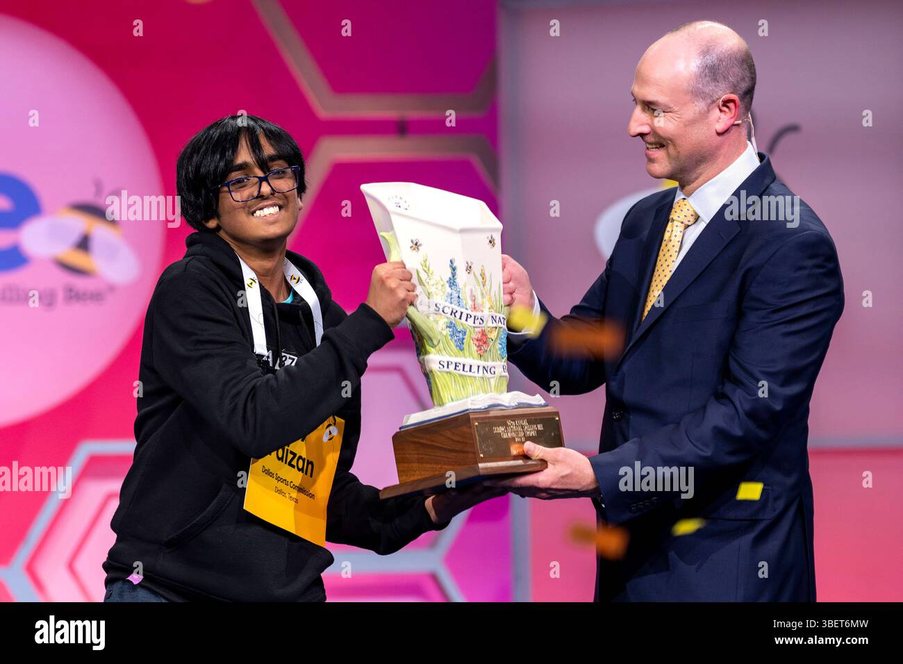 E. W. Scripps Company CEO Adam Symson hands Faizan Zaki, 13, from ...