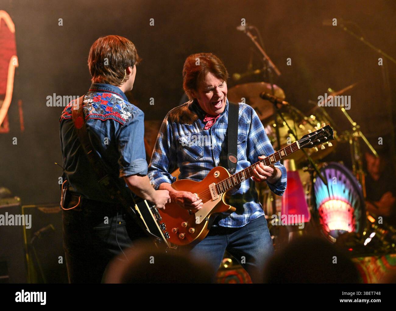 Musician John Fogerty, right, performs with his son Shane Fogerty ...