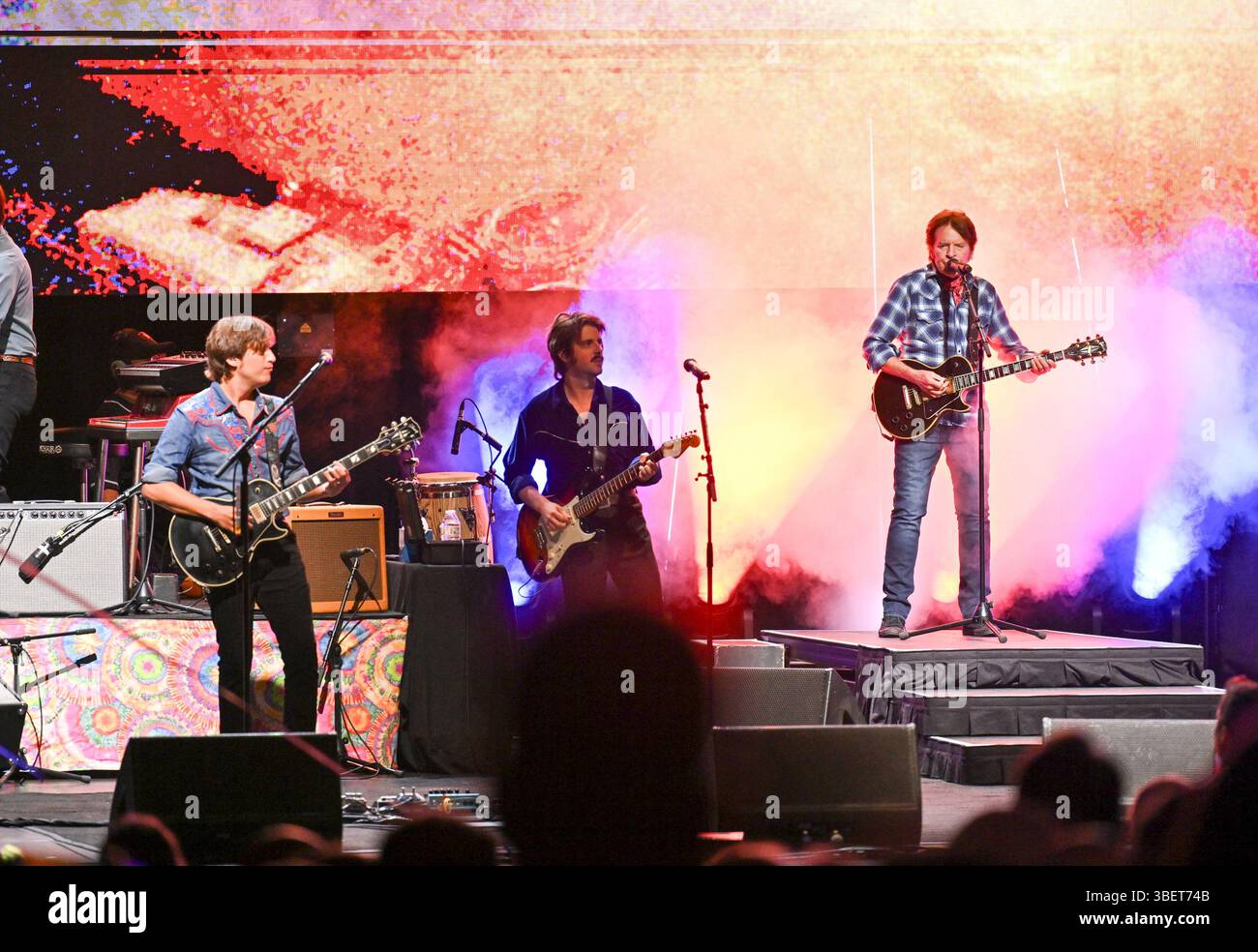 Musician John Fogerty, right, performs with his sons Shane Fogerty, far ...