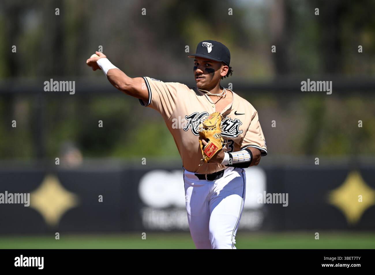 Central Florida infielder Edian Espinal (23) throws during an NCAA ...