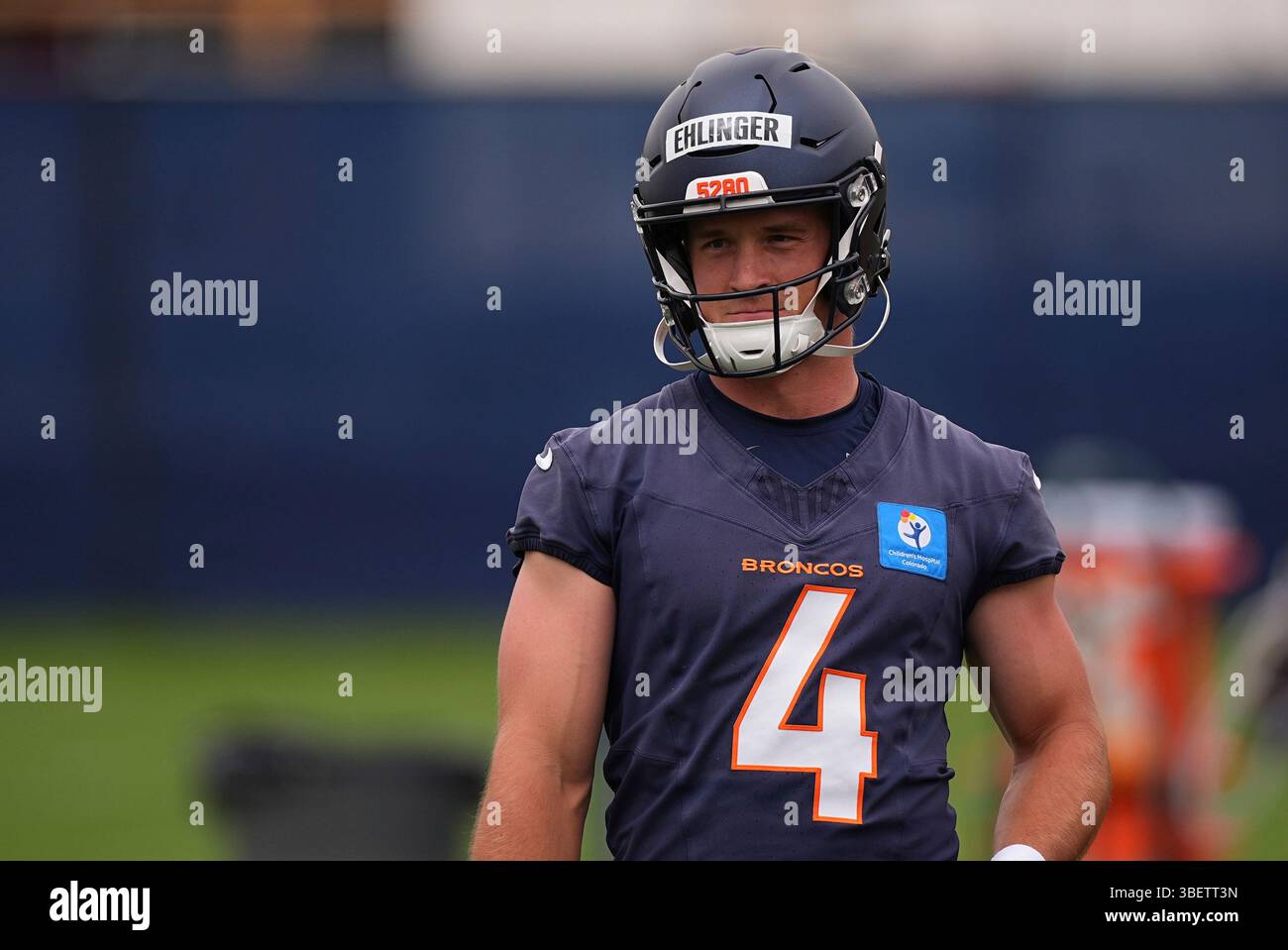 Denver Broncos quarterback Sam Ehlinger takes part in drills during an ...