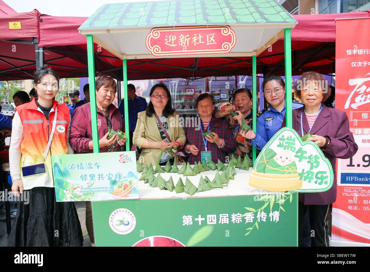 Local people take part in a zongzi making competition in Rugao City ...