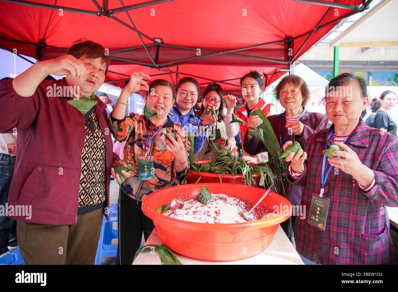 Local people take part in a zongzi making competition in Rugao City ...