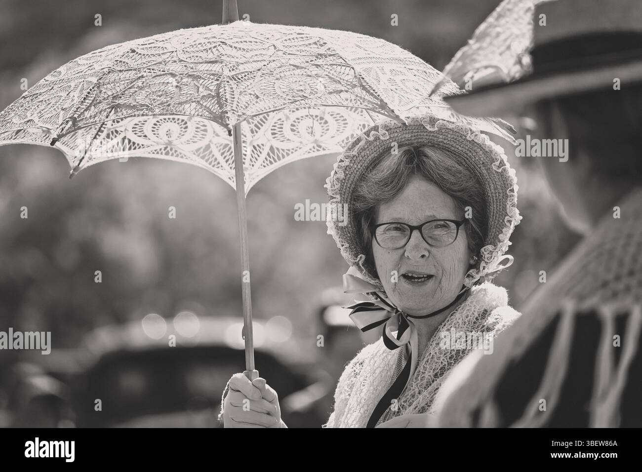 Elderly woman lady in historic old fashioned dress, holding lace ...