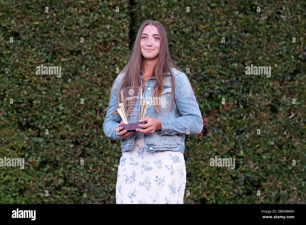Softball player Annabel Raftery poses with the Play of the Year award ...
