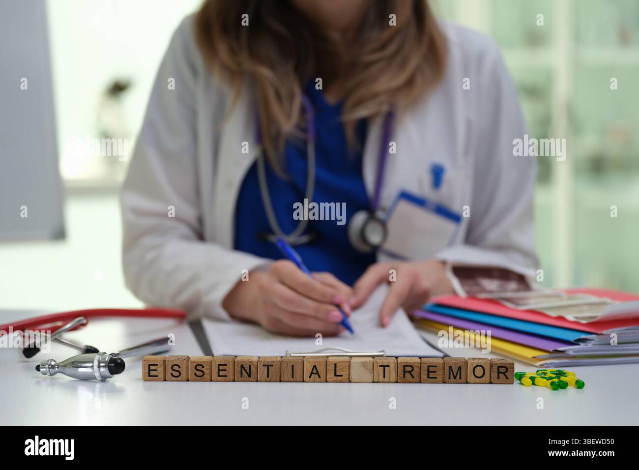 A Health Professional Conducting an Examination of Essential Tremor ...