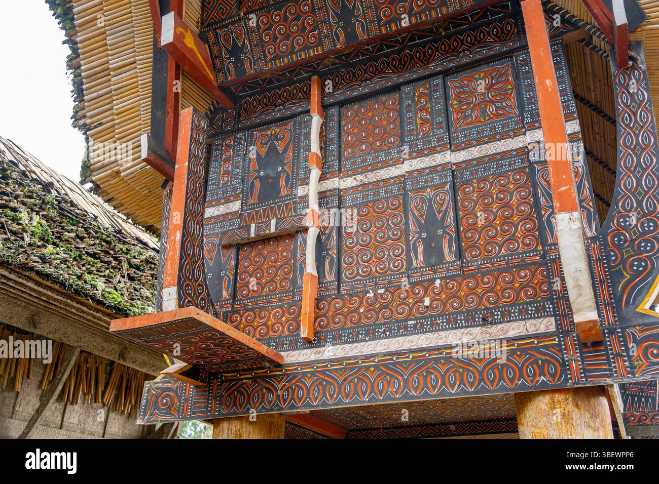 Geometric patterns and symbolic motifs decorate the wooden panels of a ...