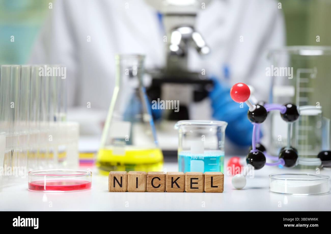 The laboratory scene prominently showcases nickel, numerous chemicals ...