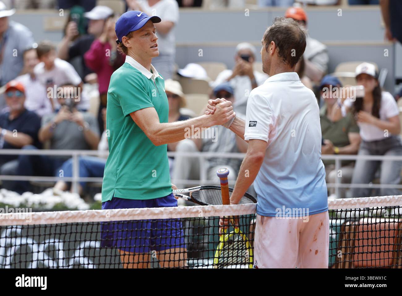 Jannik Sinner of Italy shakes hands with Richard Gasquet of France after his victory during day ...
