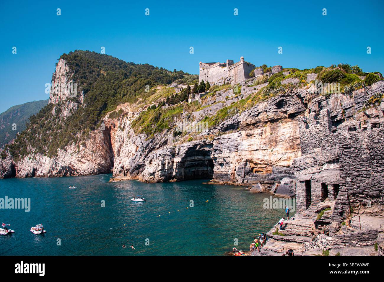 Dramatic cliffs plunge into the blue waters of the Ligurian Sea ...