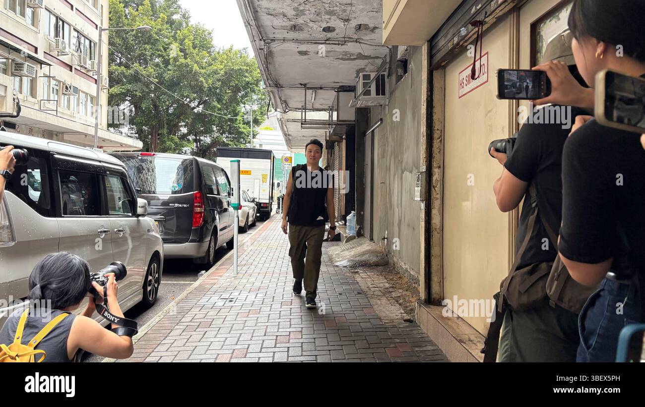 Hong Kong's pro-democracy activist Jimmy Sham, center, is released from ...