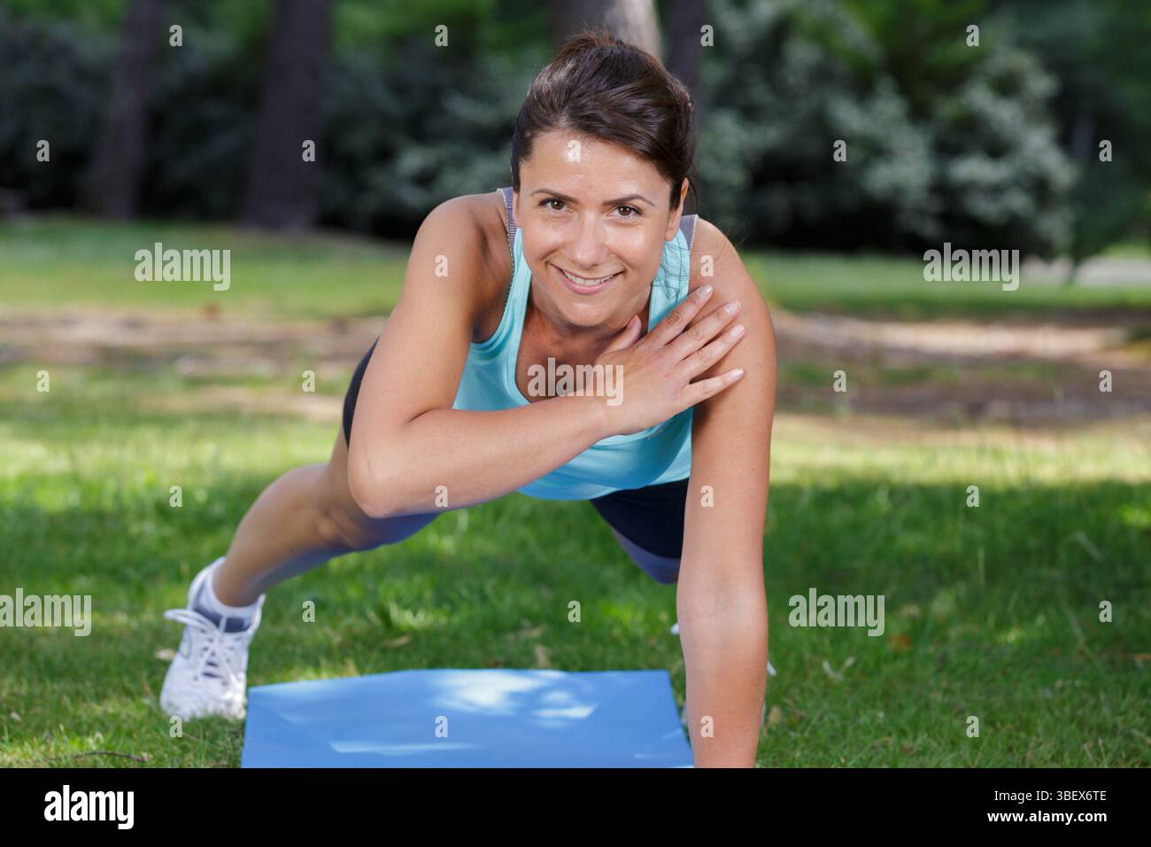young athletic woman exercising outdoors Stock Photo - Alamy