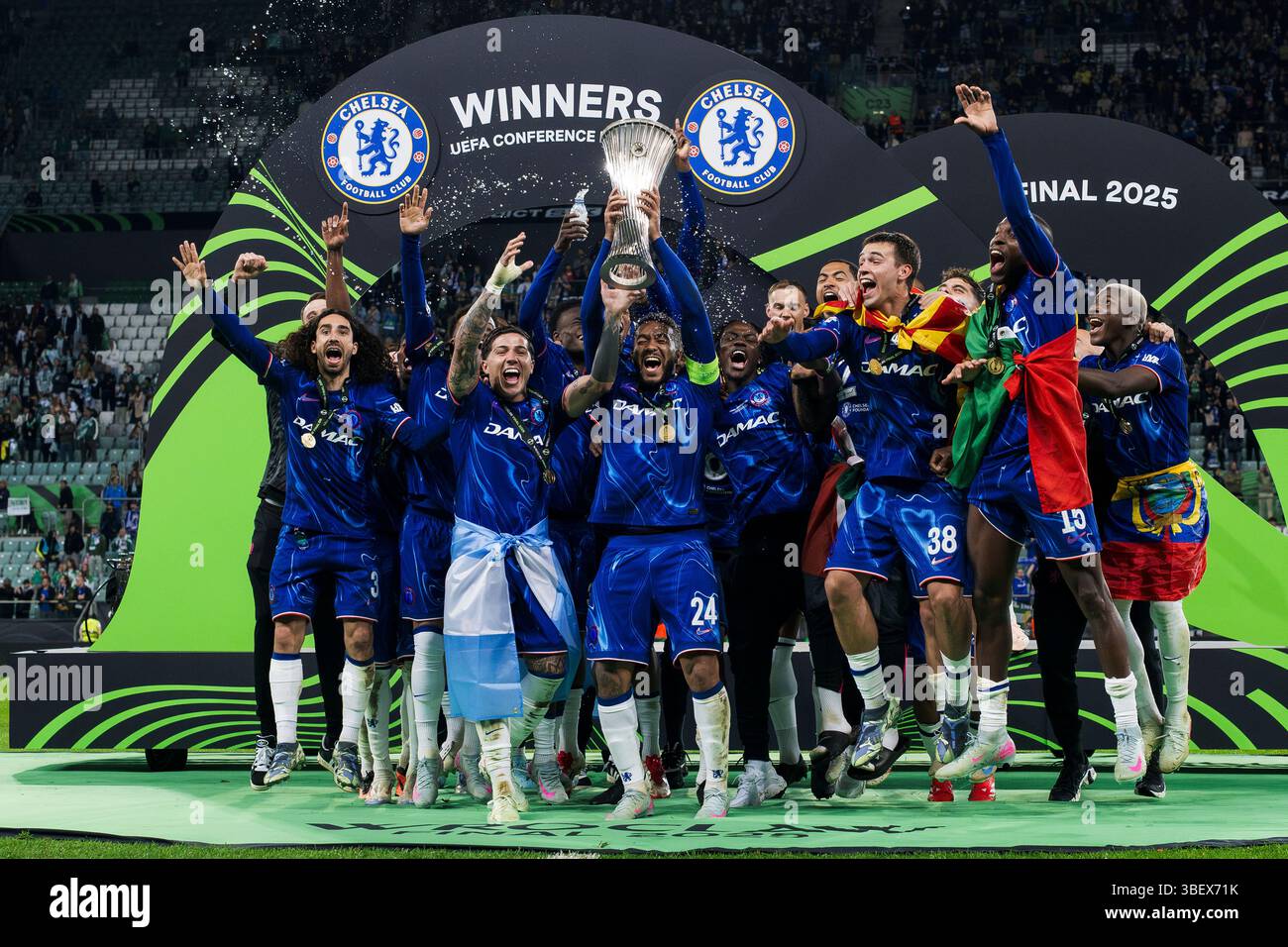 Reece James of Chelsea FC lifts the trophy as teammates celebrate ...