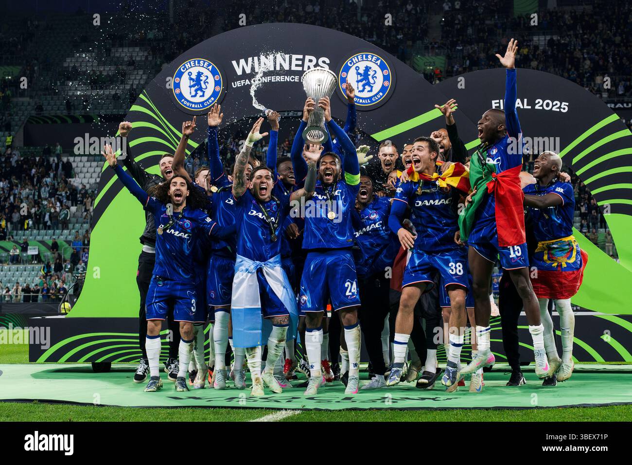 Reece James of Chelsea FC lifts the trophy as teammates celebrate ...