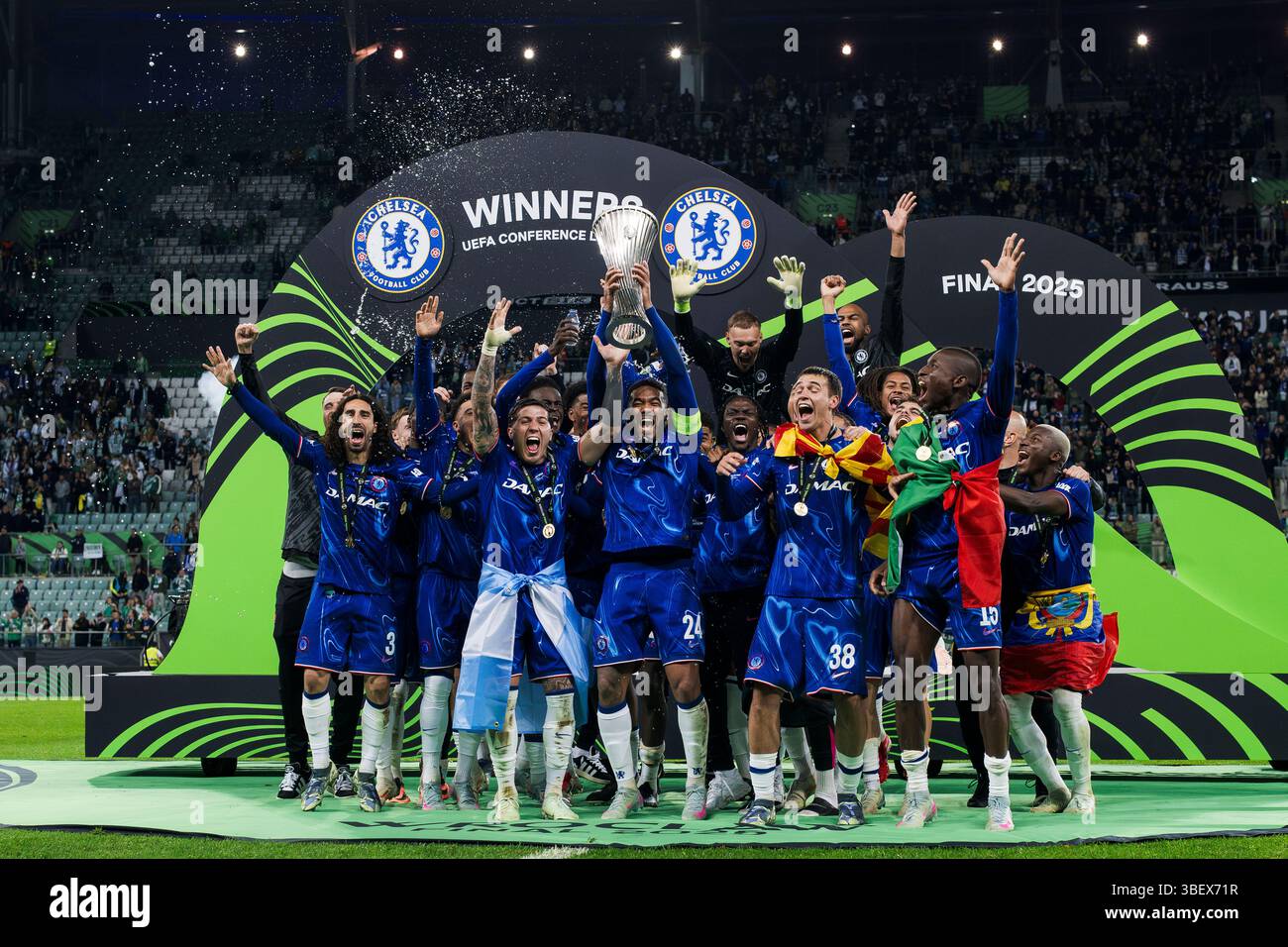 Reece James of Chelsea FC lifts the trophy as teammates celebrate ...