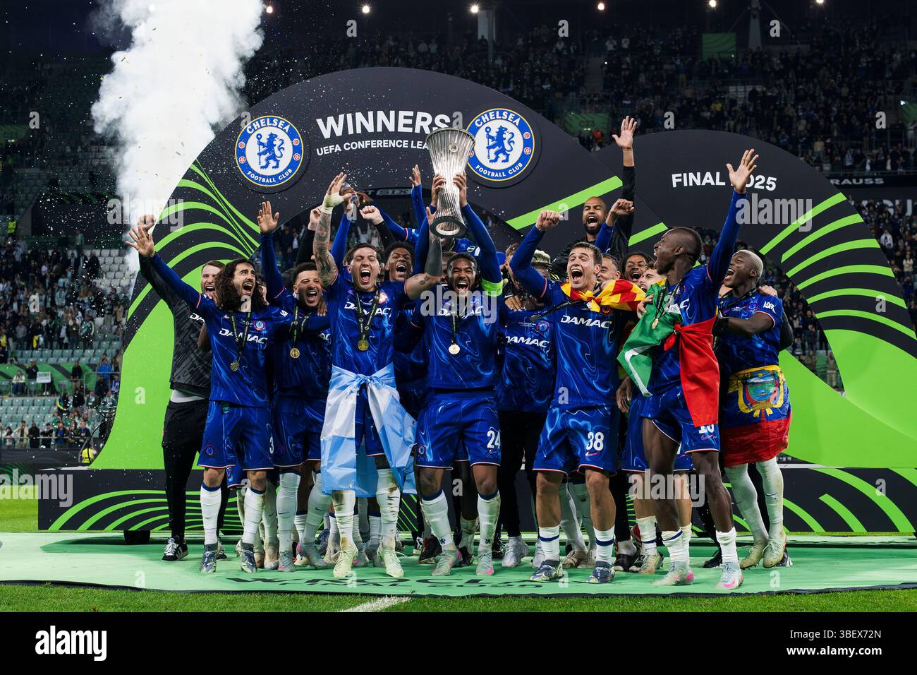 Reece James of Chelsea FC lifts the trophy as teammates celebrate ...