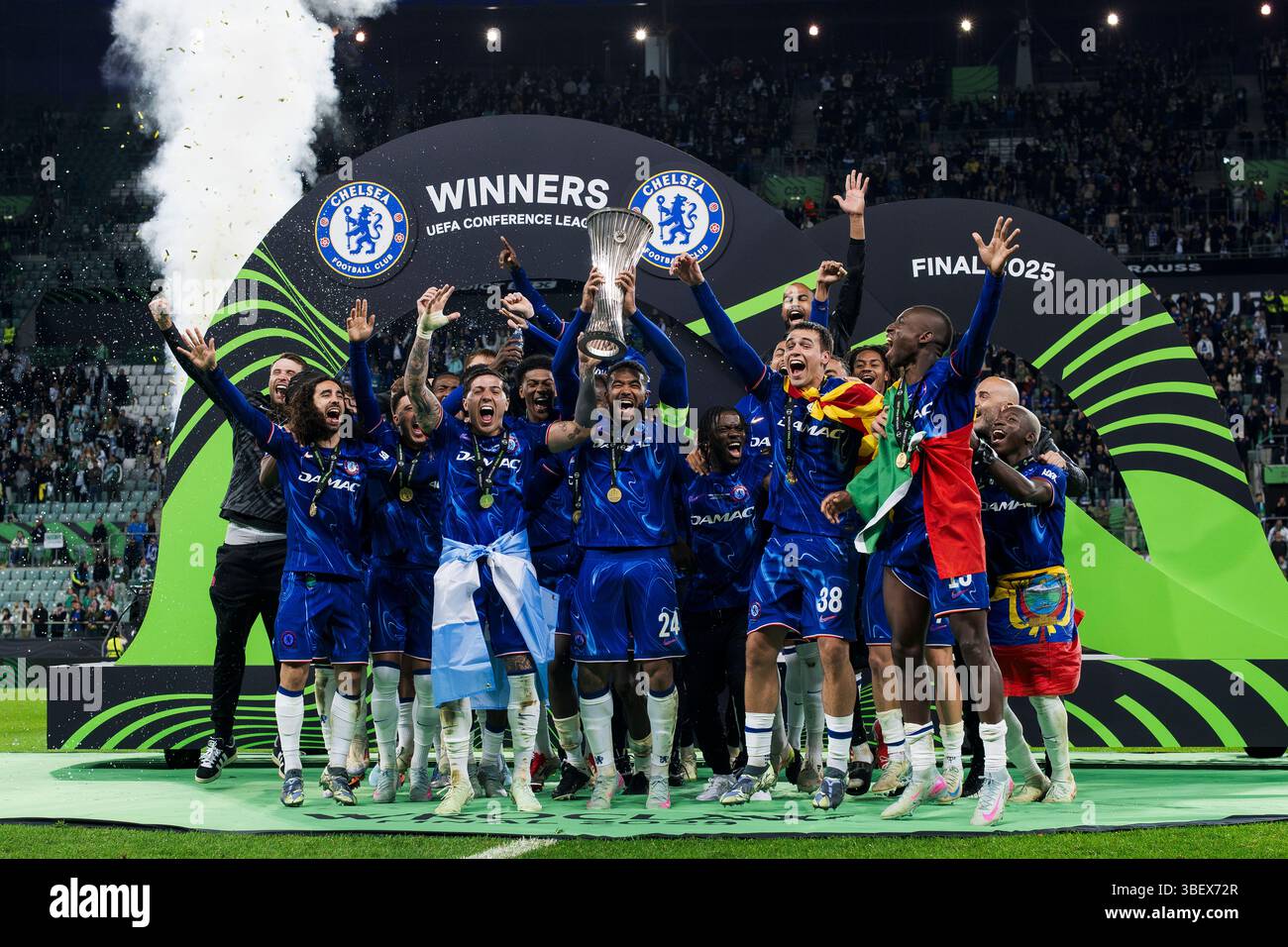 Reece James of Chelsea FC lifts the trophy as teammates celebrate ...