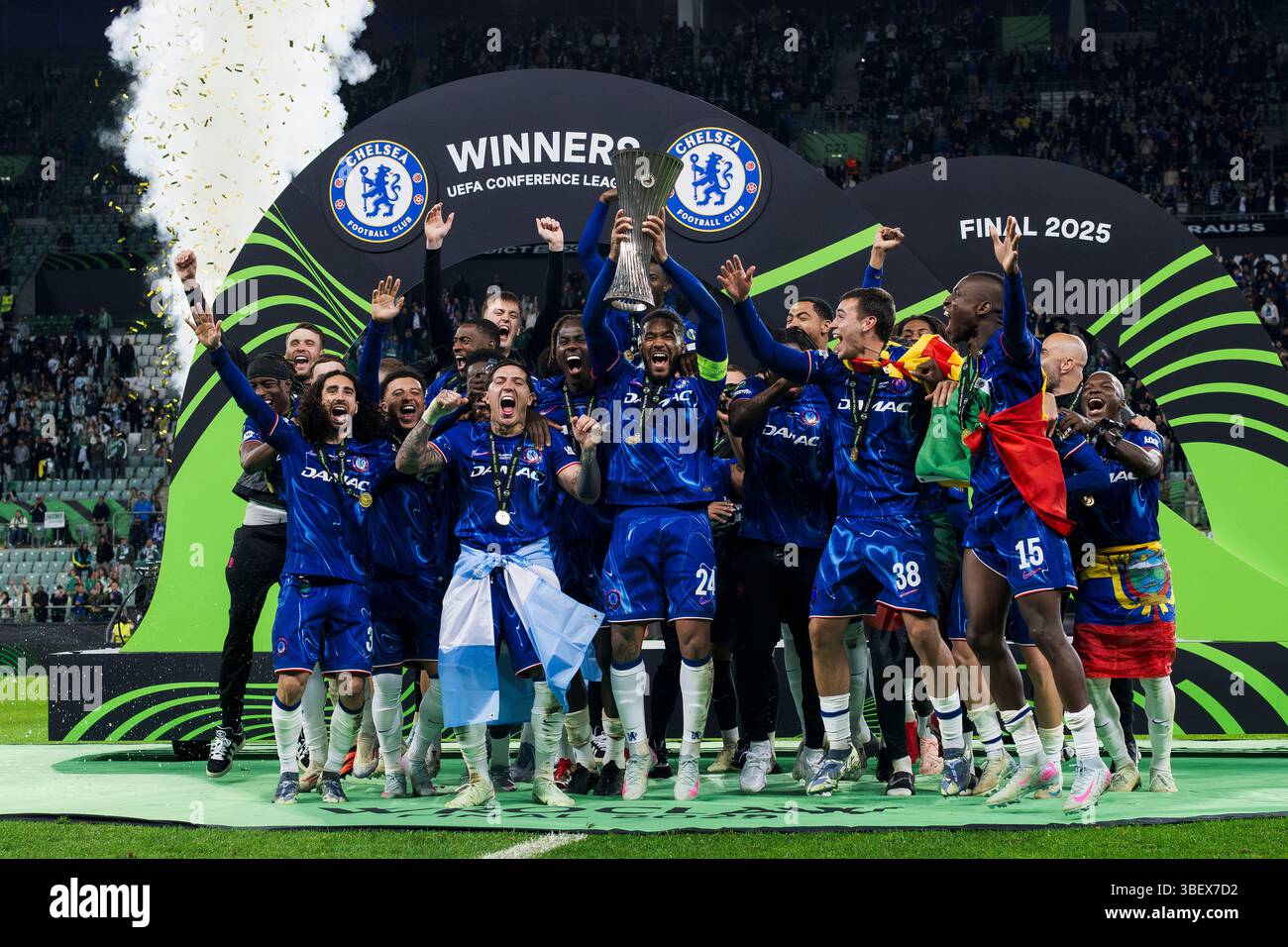 Reece James of Chelsea FC lifts the trophy as teammates celebrate ...