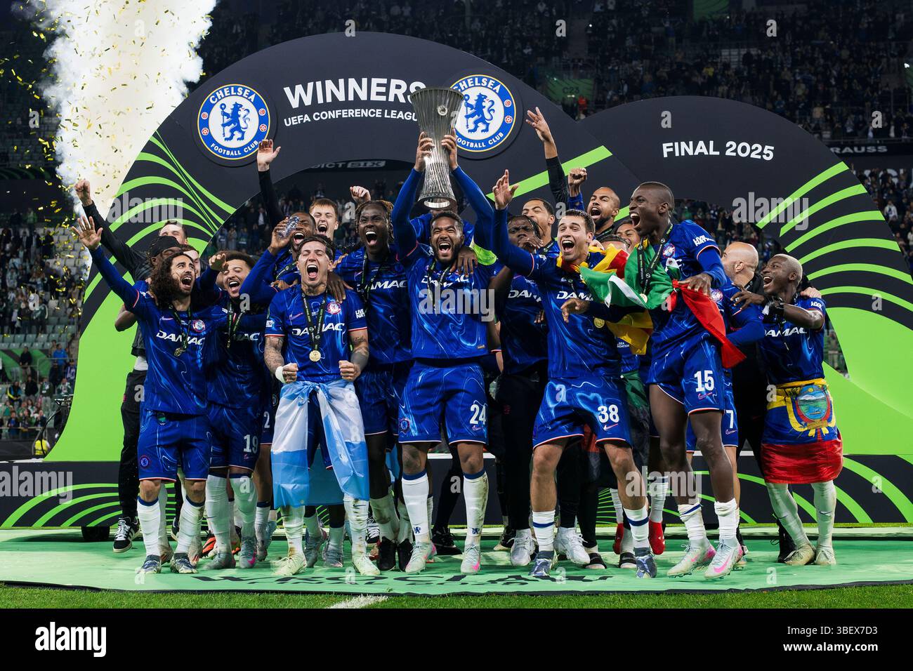 Reece James of Chelsea FC lifts the trophy as teammates celebrate ...