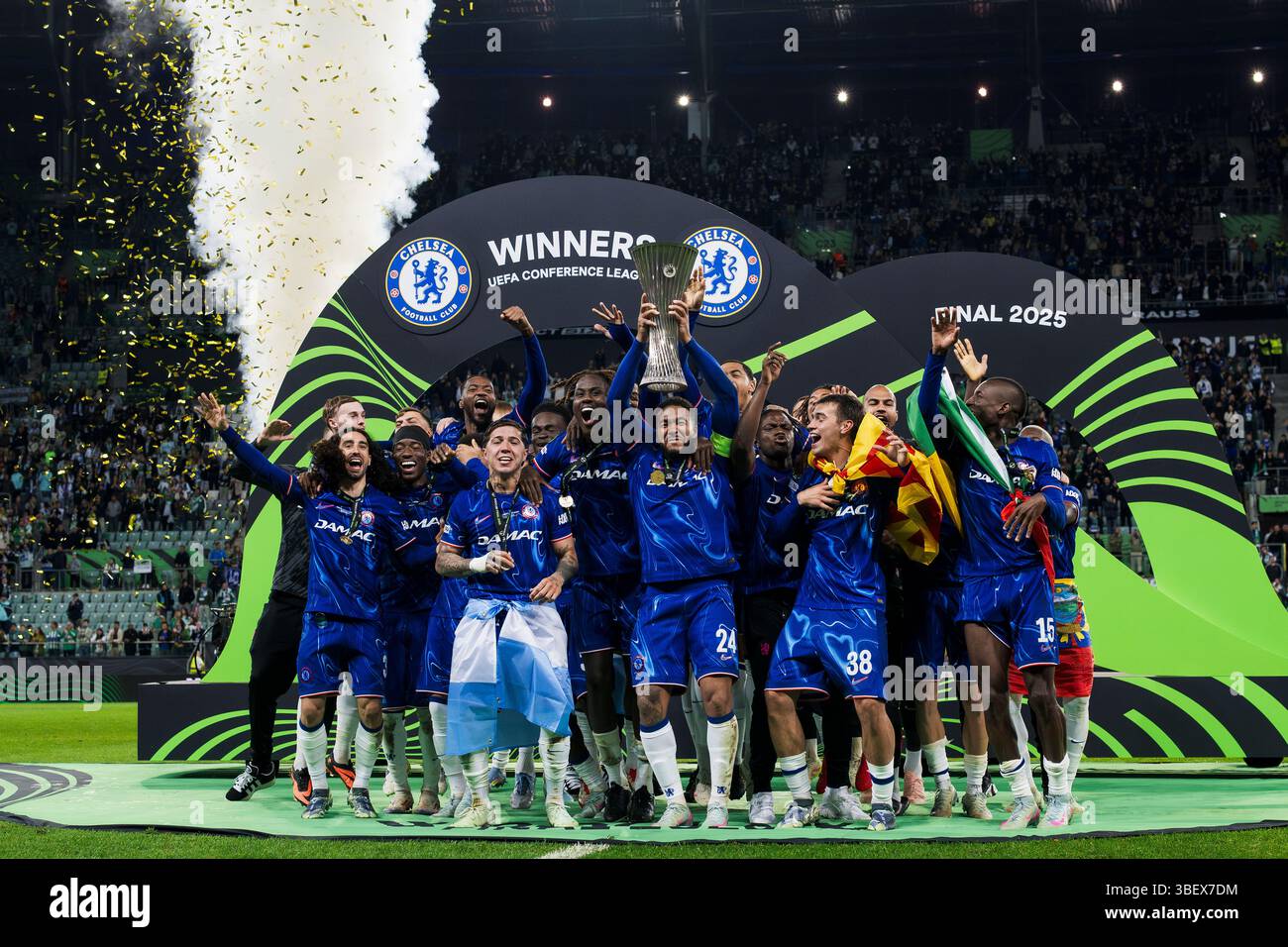 Reece James of Chelsea FC lifts the trophy as teammates celebrate ...