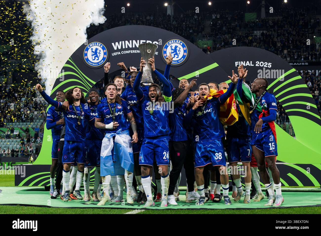 Reece James of Chelsea FC lifts the trophy as teammates celebrate ...