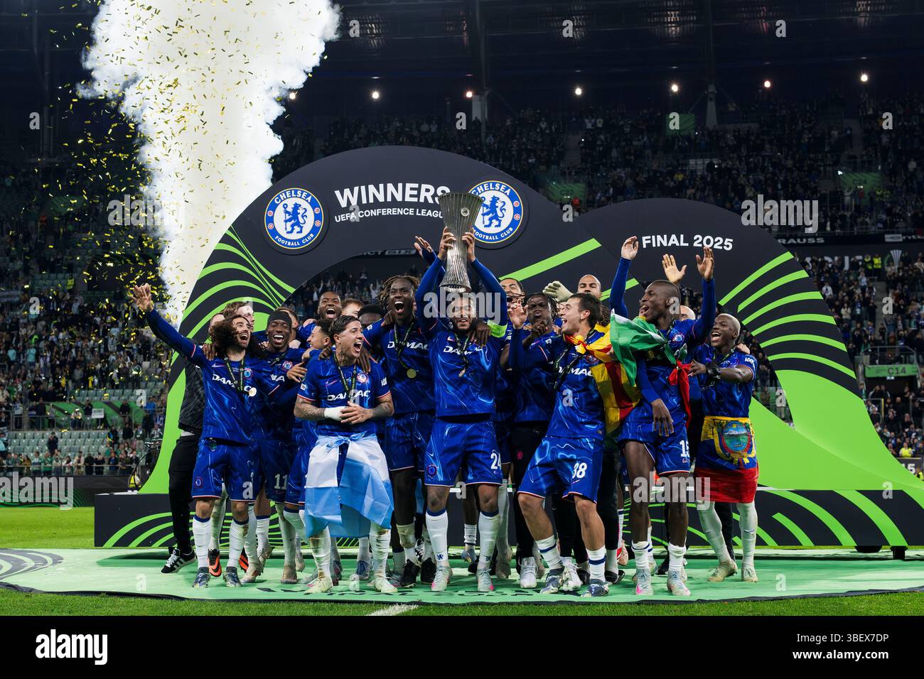 Reece James of Chelsea FC lifts the trophy as teammates celebrate ...