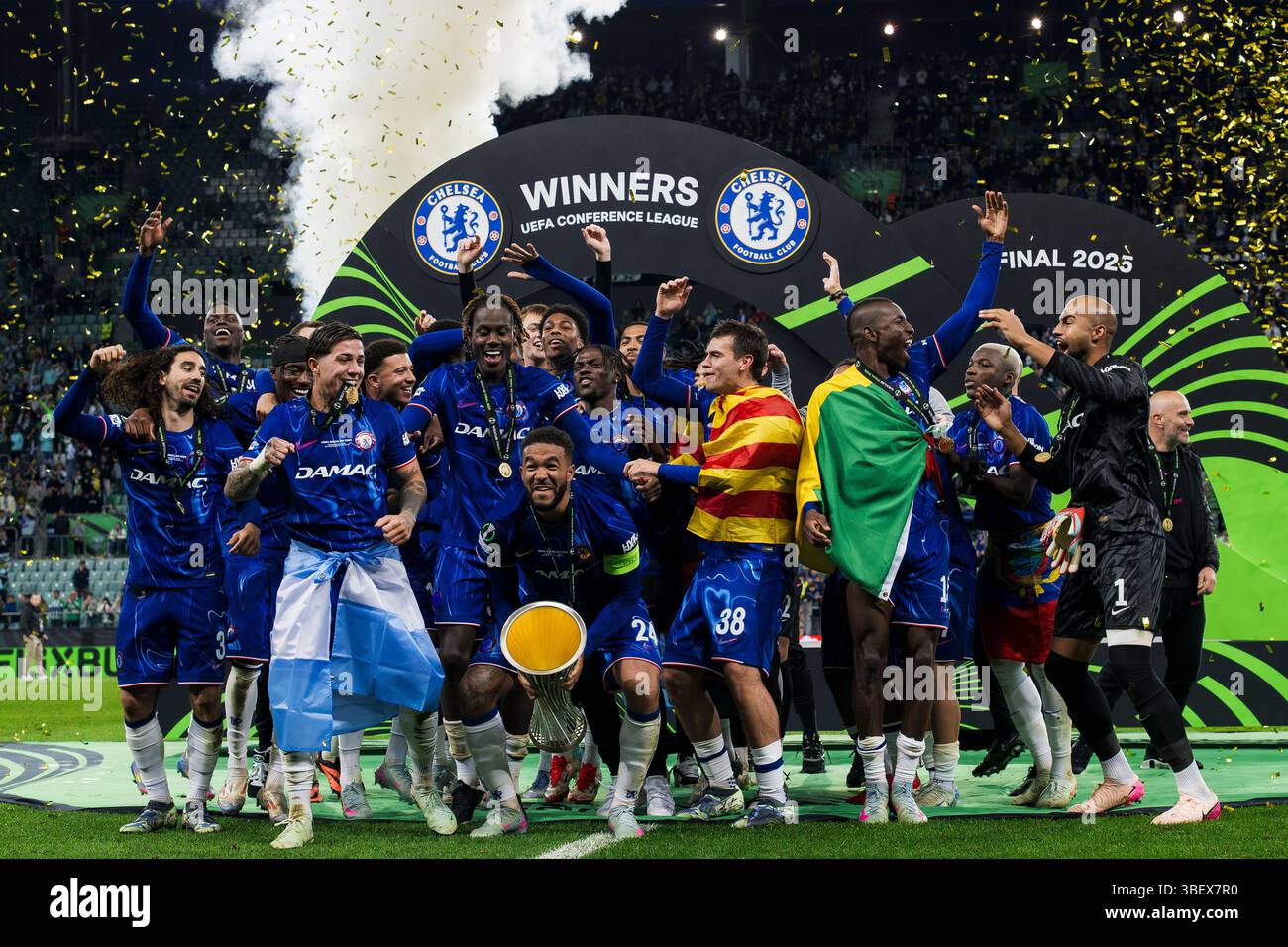 Reece James of Chelsea FC lifts the trophy as teammates celebrate ...