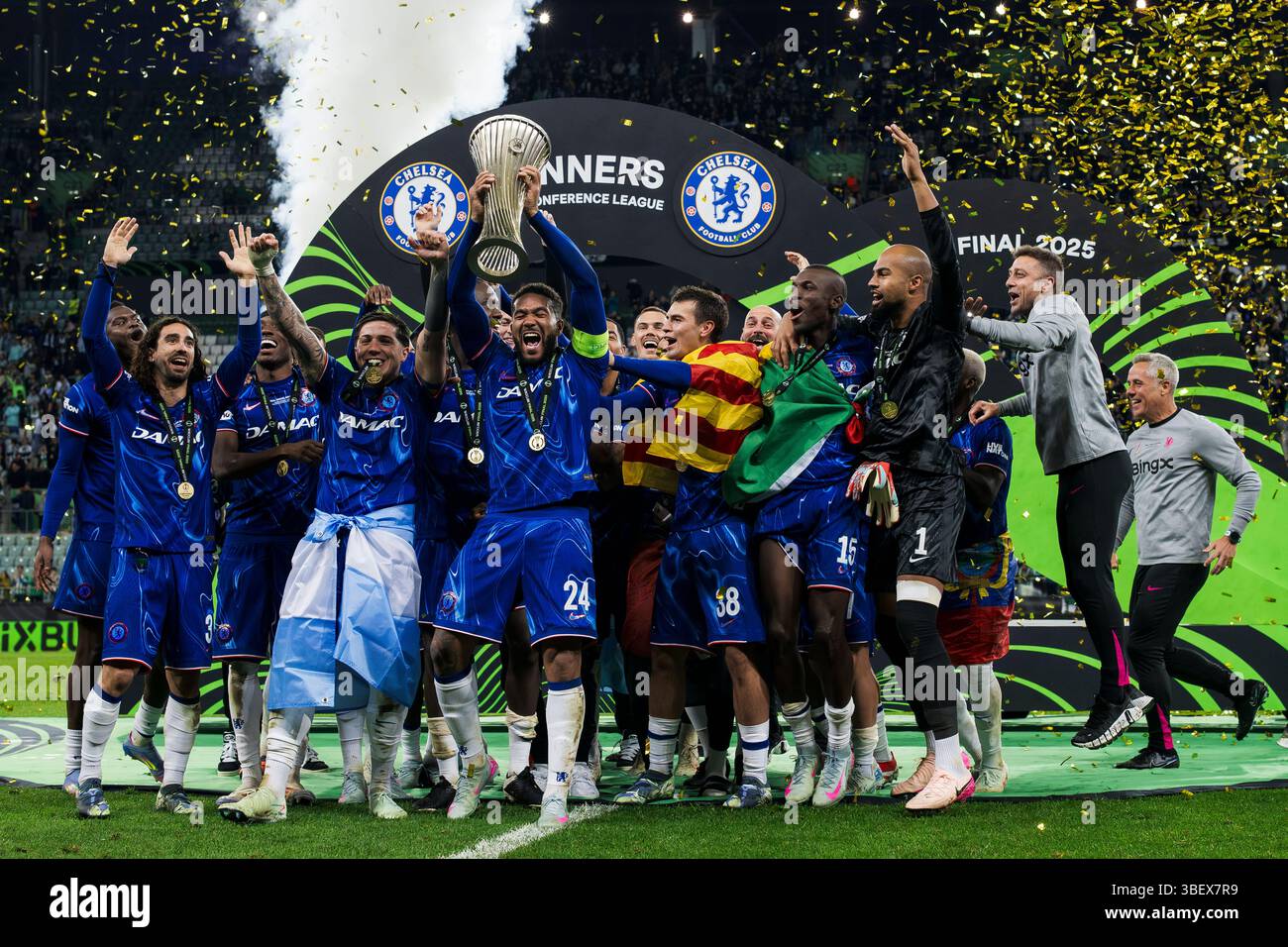 Reece James of Chelsea FC lifts the trophy as teammates celebrate ...