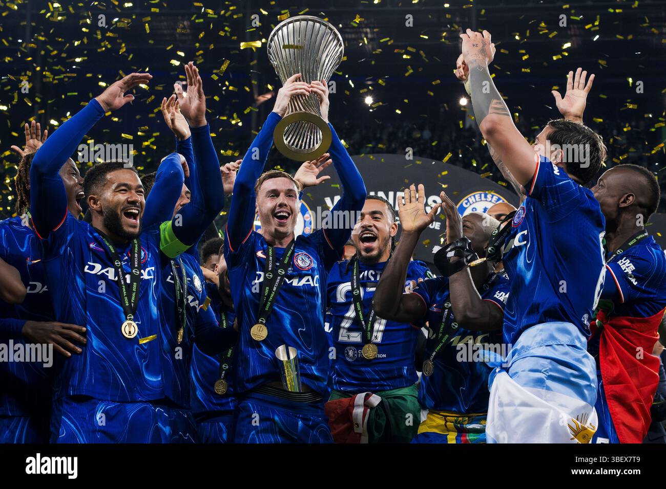 Cole Palmer of Chelsea FC lifts the trophy as teammates celebrates ...