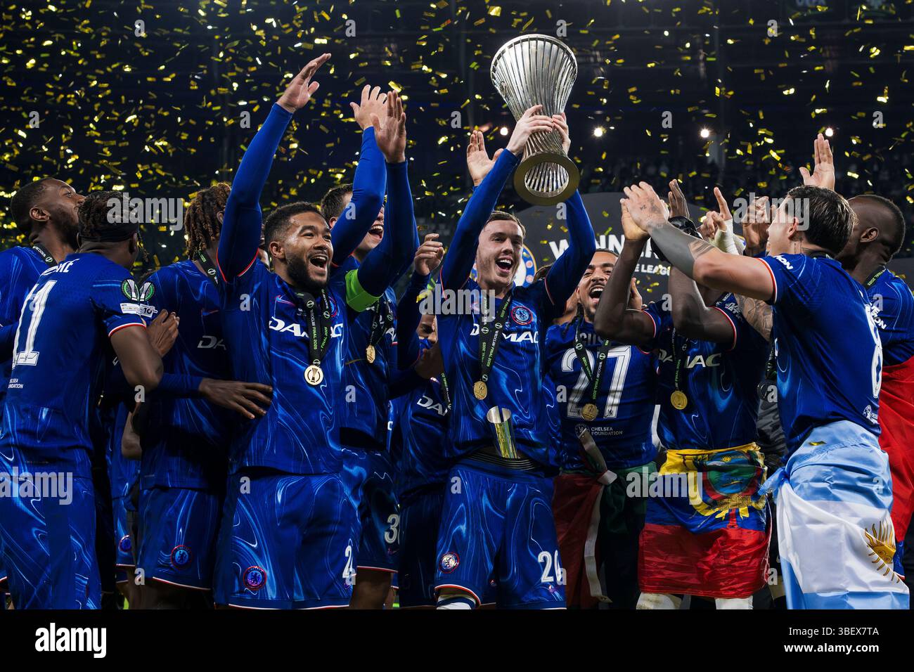 Cole Palmer of Chelsea FC lifts the trophy as teammates celebrates ...