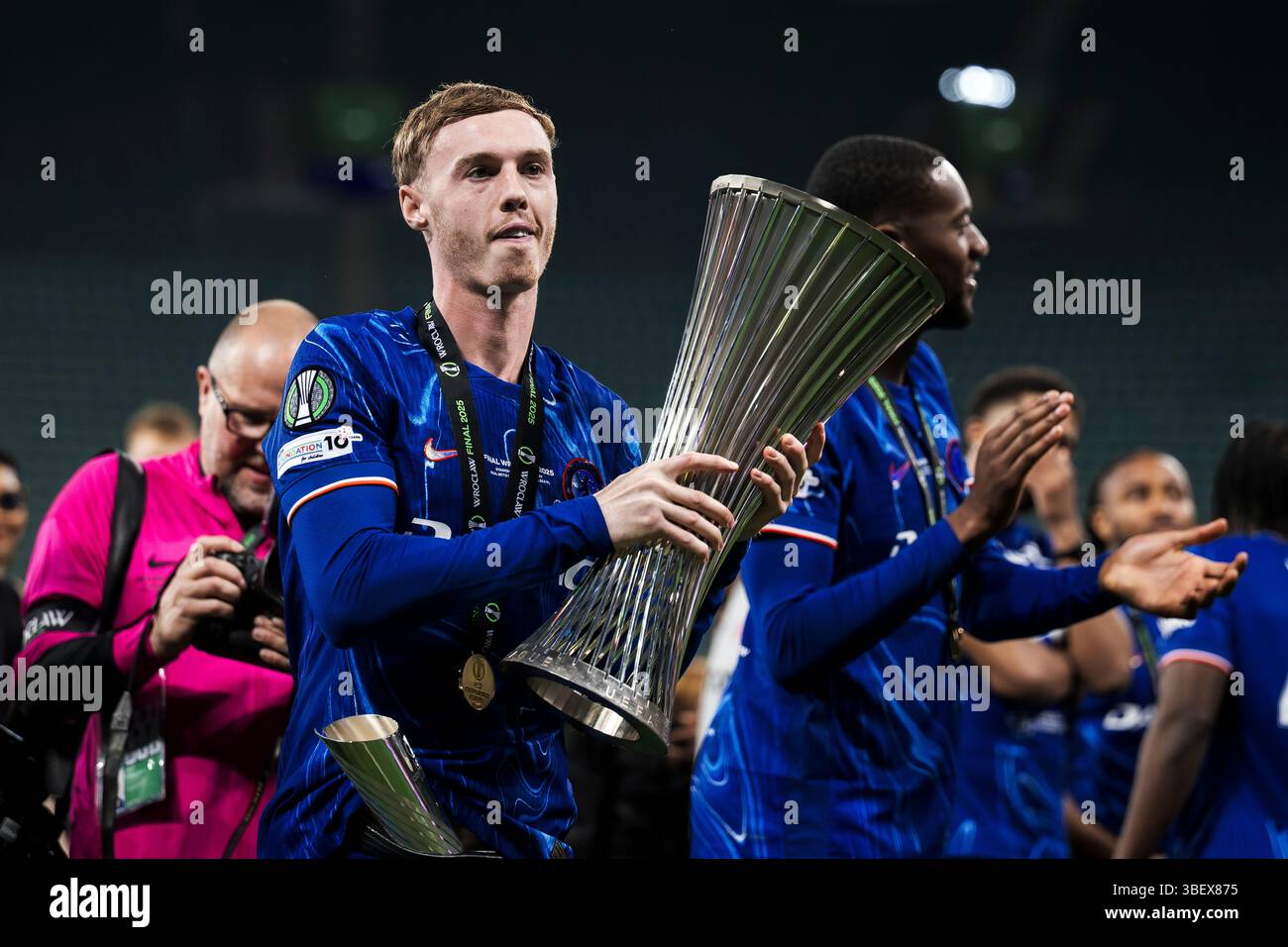 Cole Palmer of Chelsea FC lifts the trophy during the award ceremony ...