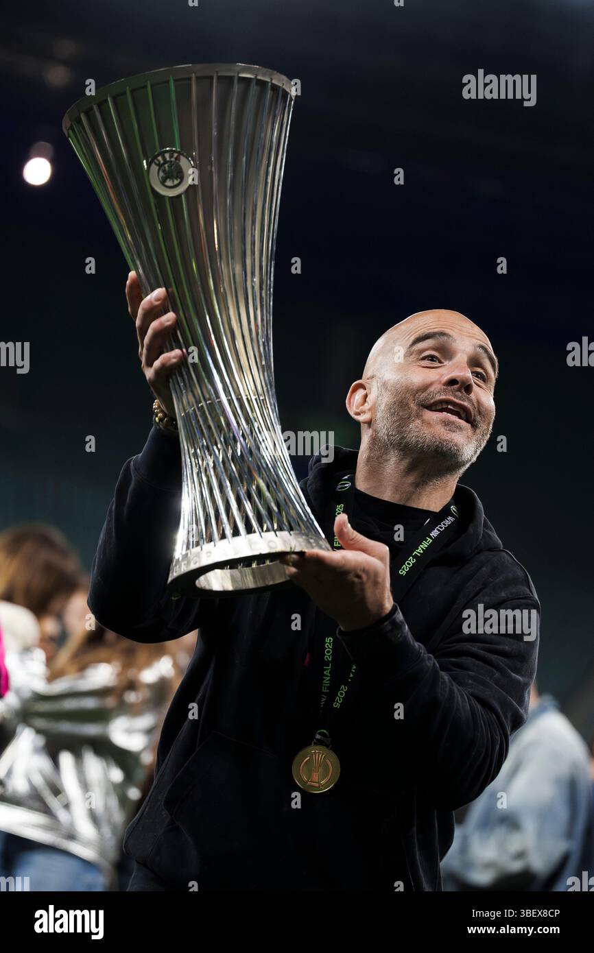 Enzo Maresca, head coach of Chelsea FC, lifts the trophy during the ...