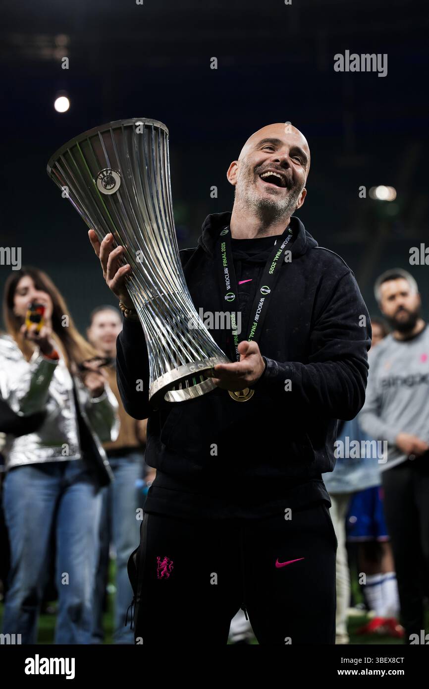 Enzo Maresca, head coach of Chelsea FC, lifts the trophy during the ...