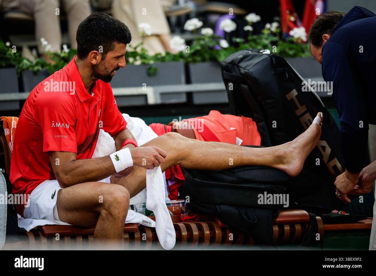 Novak DJOKOVIC of Serbia looks injured during the fifth day of the ...