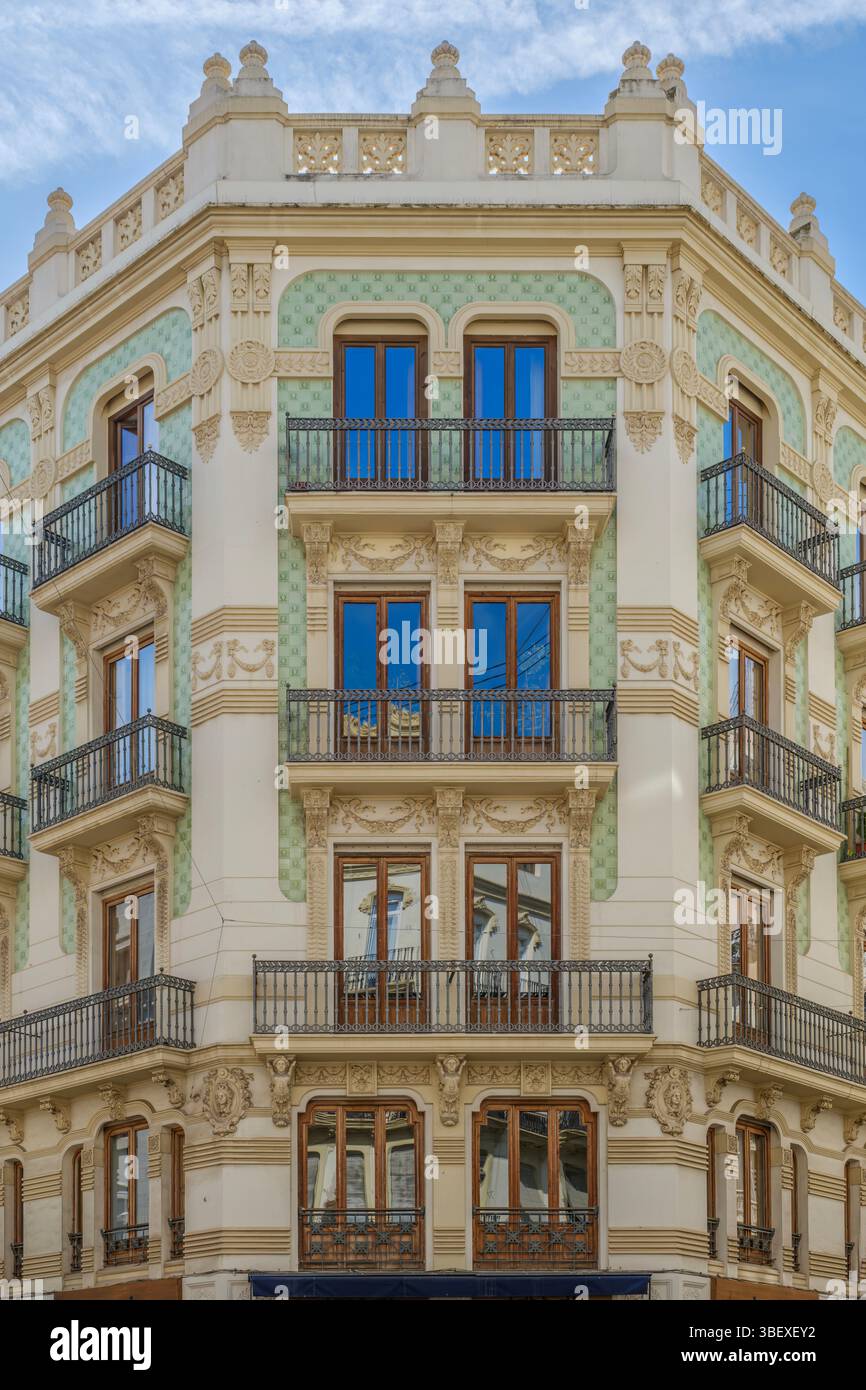 An elegant apartment building facade in Valencia, Spain, featuring ...