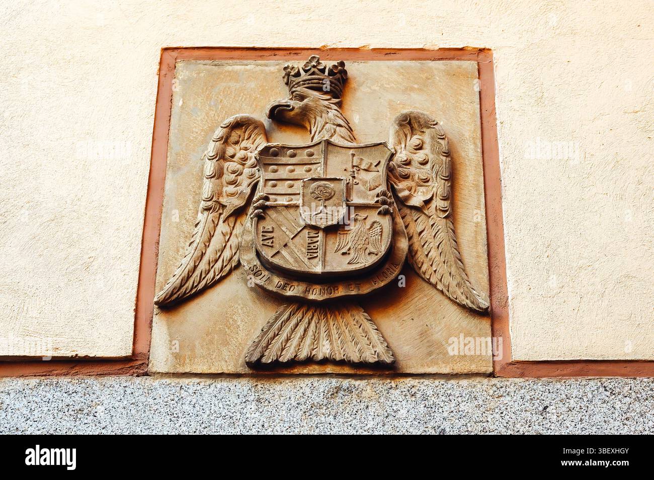 Ancient stone coat of arms on the facade of a building Stock Photo - Alamy