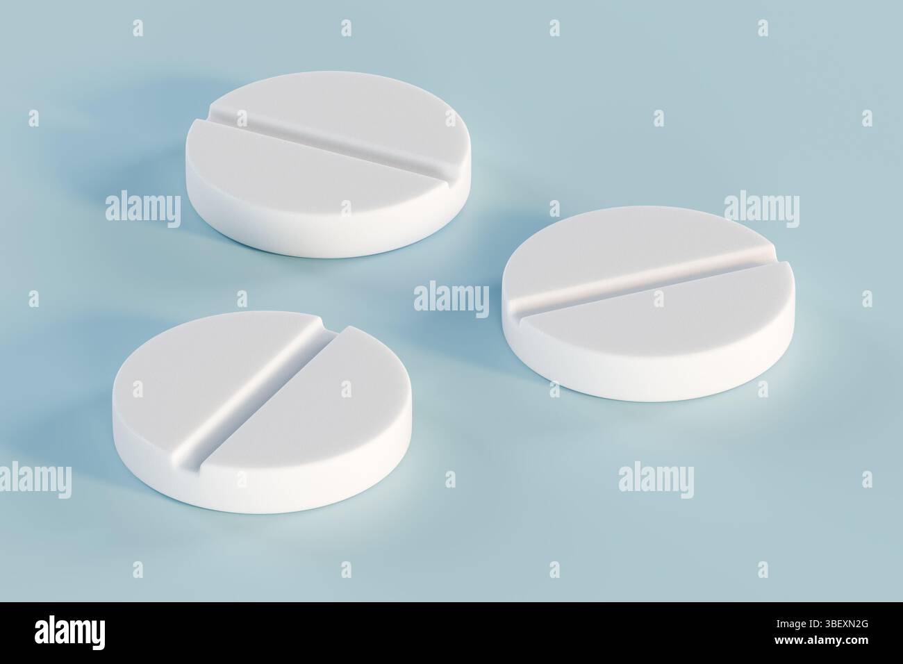 Three white round tablets with a scored line on a light blue background ...