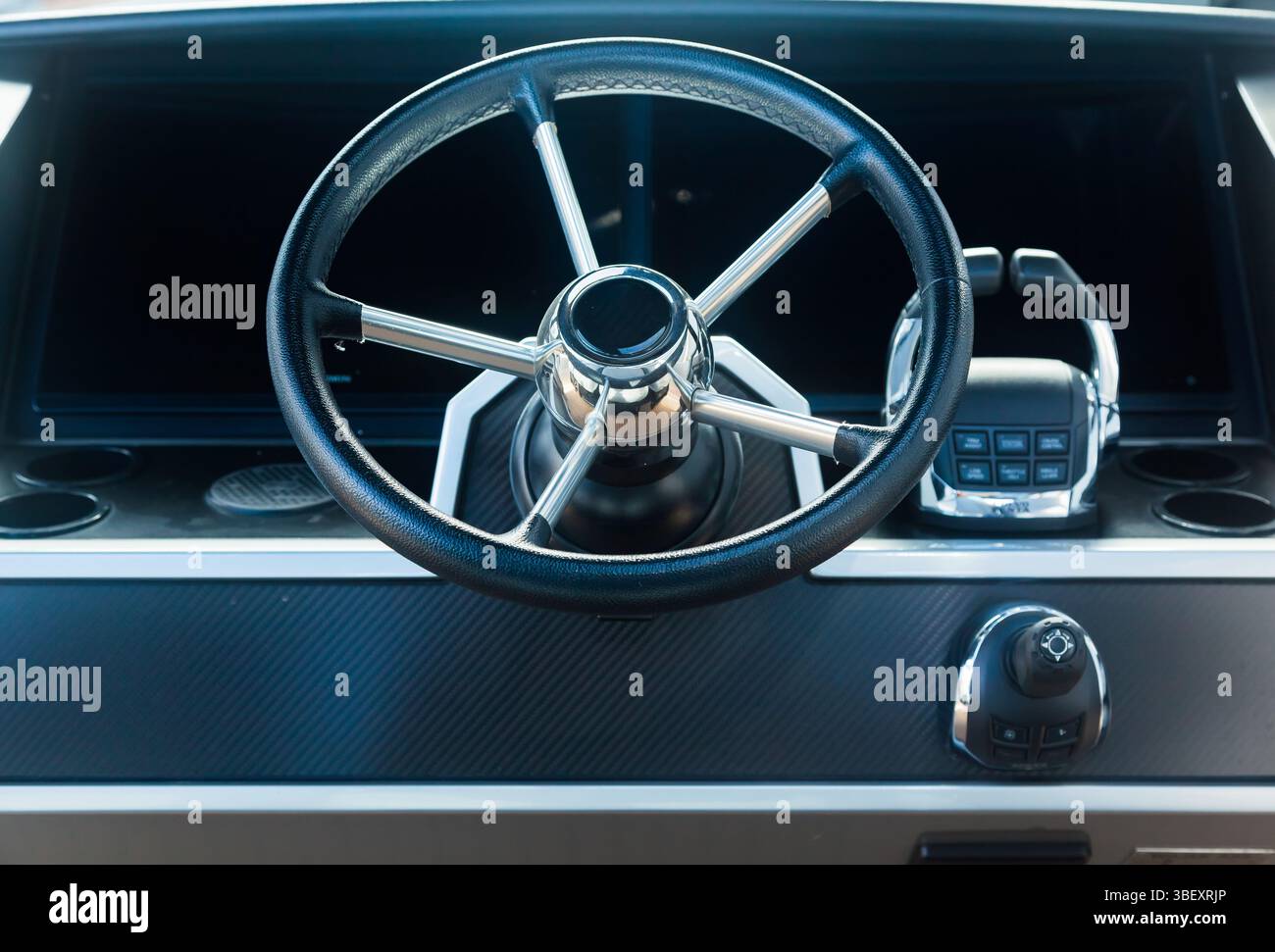 Motor yacht control panel. Steering wheel and gear levers Stock Photo ...