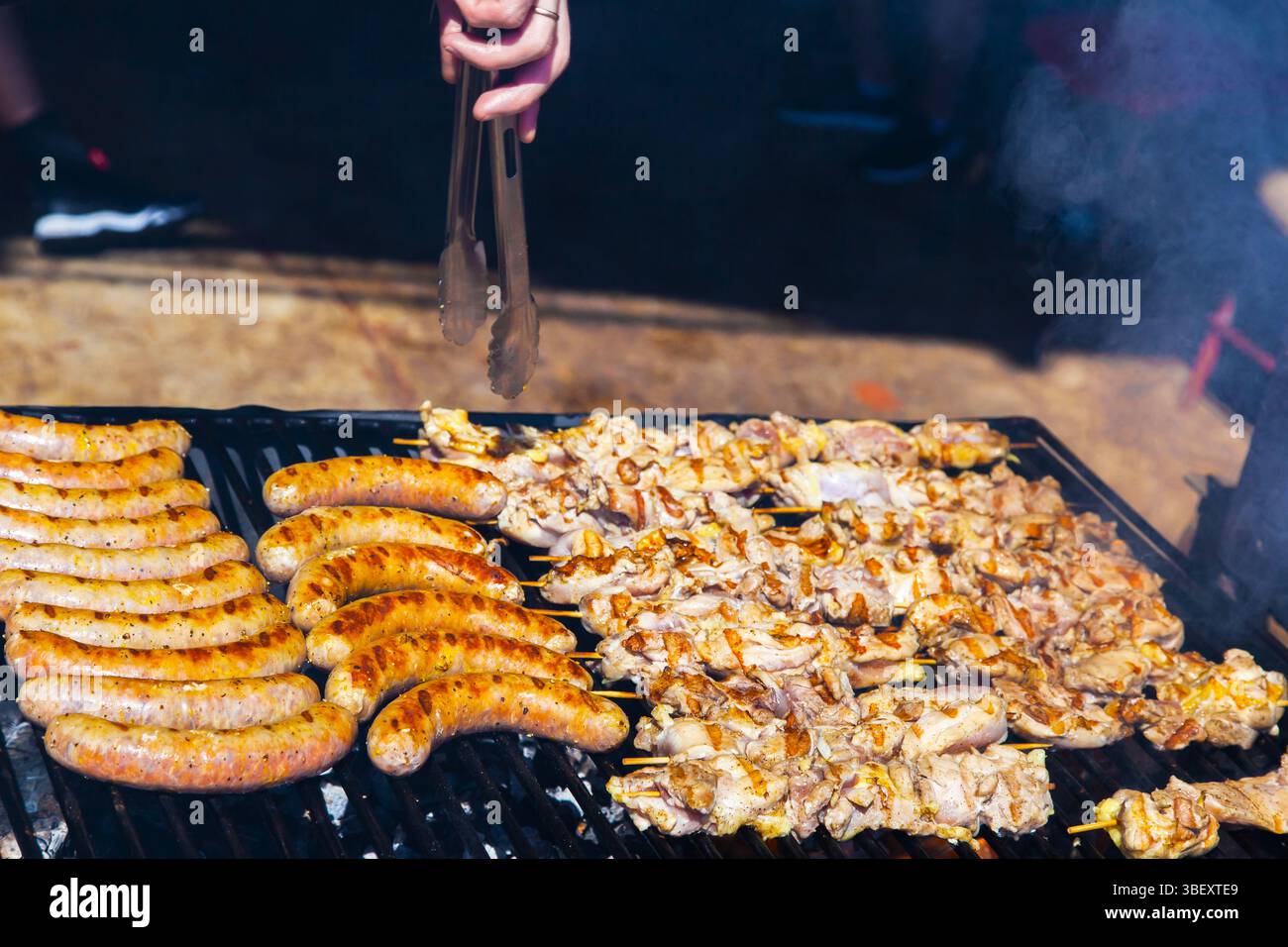 Male hand flips meat hi-res stock photography and images - Alamy