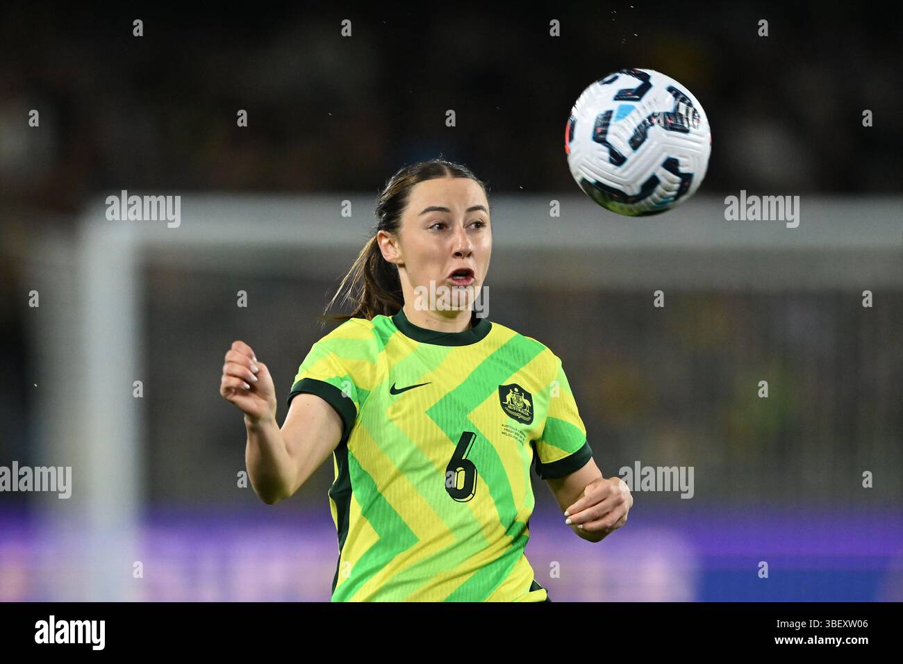 Clare Wheeler of Australia headers the ball during the Women's friendly ...