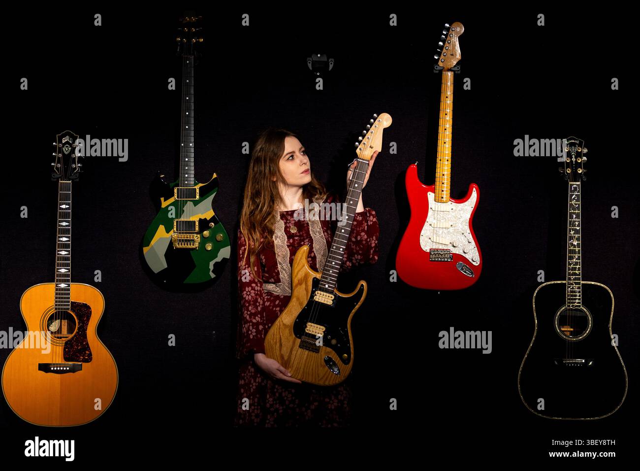 A member of staff looks at a Rory Gallagher: Dave Edwards custom ...
