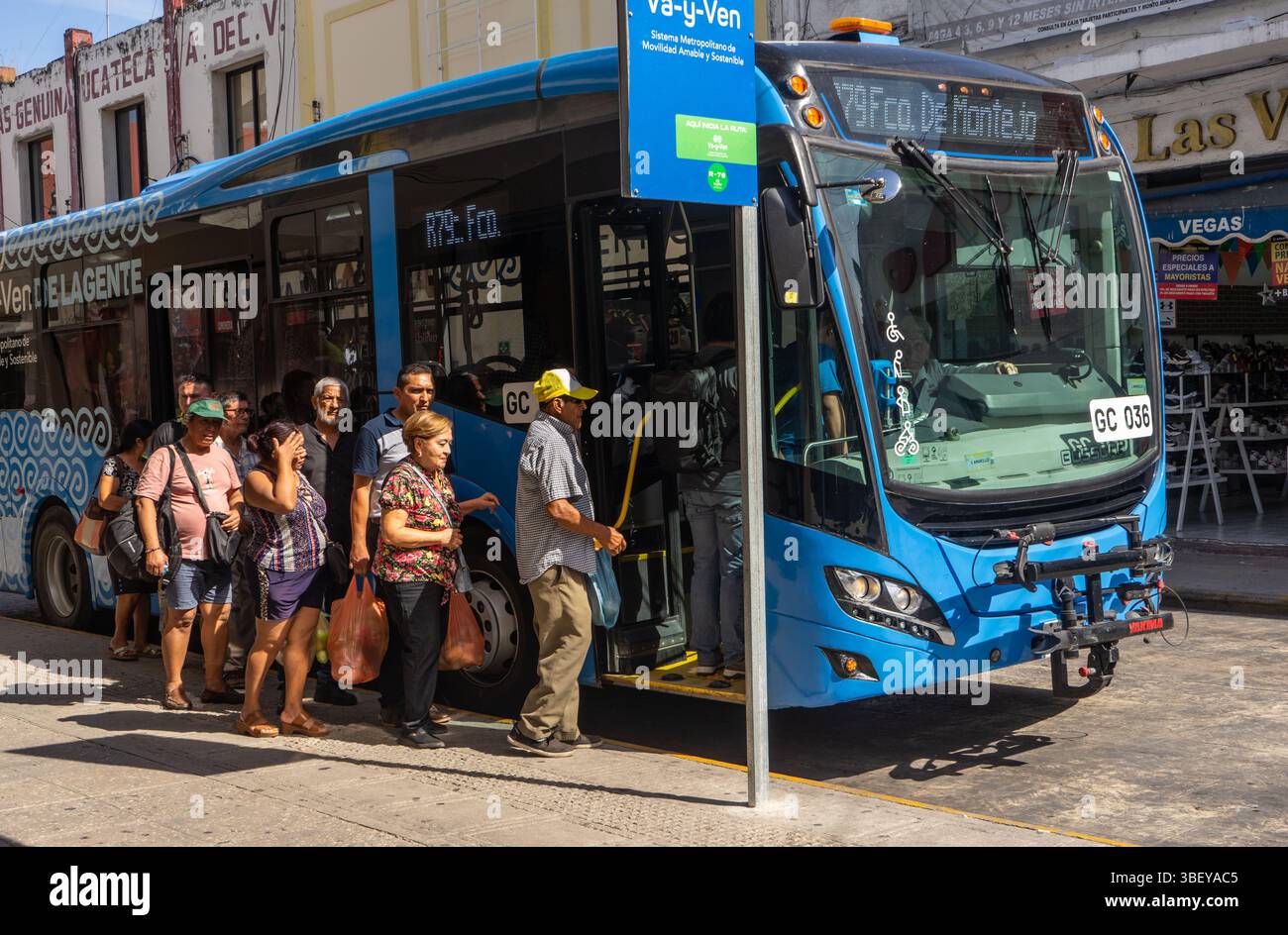 Passengers boarding public electric bus in Merida, Yucatan, Mexico ...