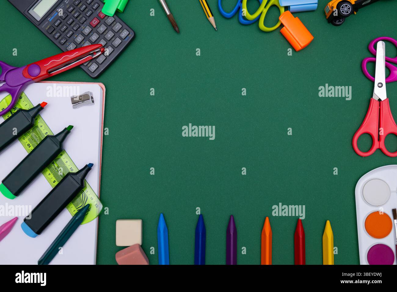 Assorted school supplies including colored pencils, markers, scissors ...